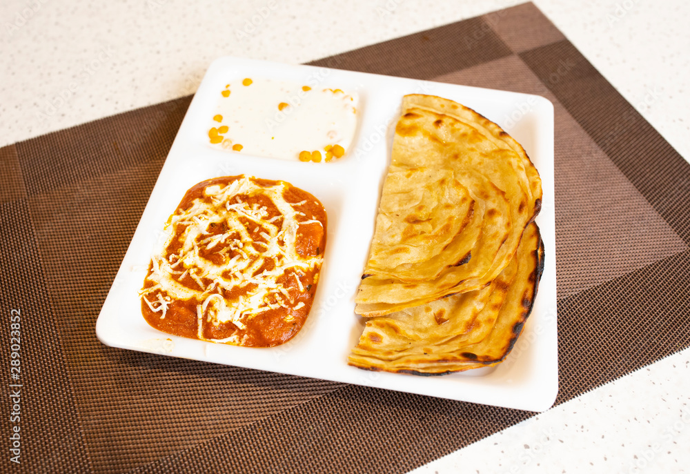 Indian Cuisine Combo Thali With Paneer Butter Masala, Kulcha Bread Or ...