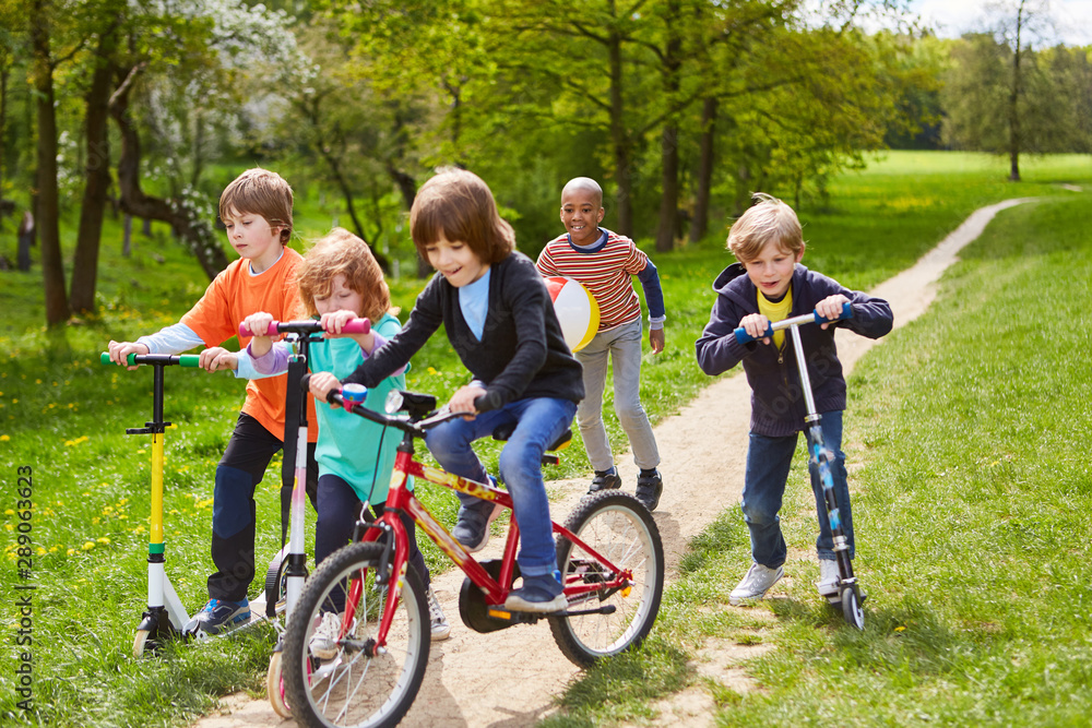 Group of kids in a park is making a race Stock Photo | Adobe Stock
