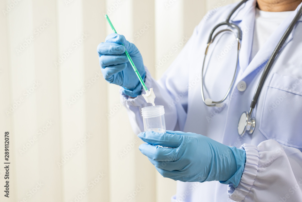 Doctor hand holding liquid base cytology set on blue background ...