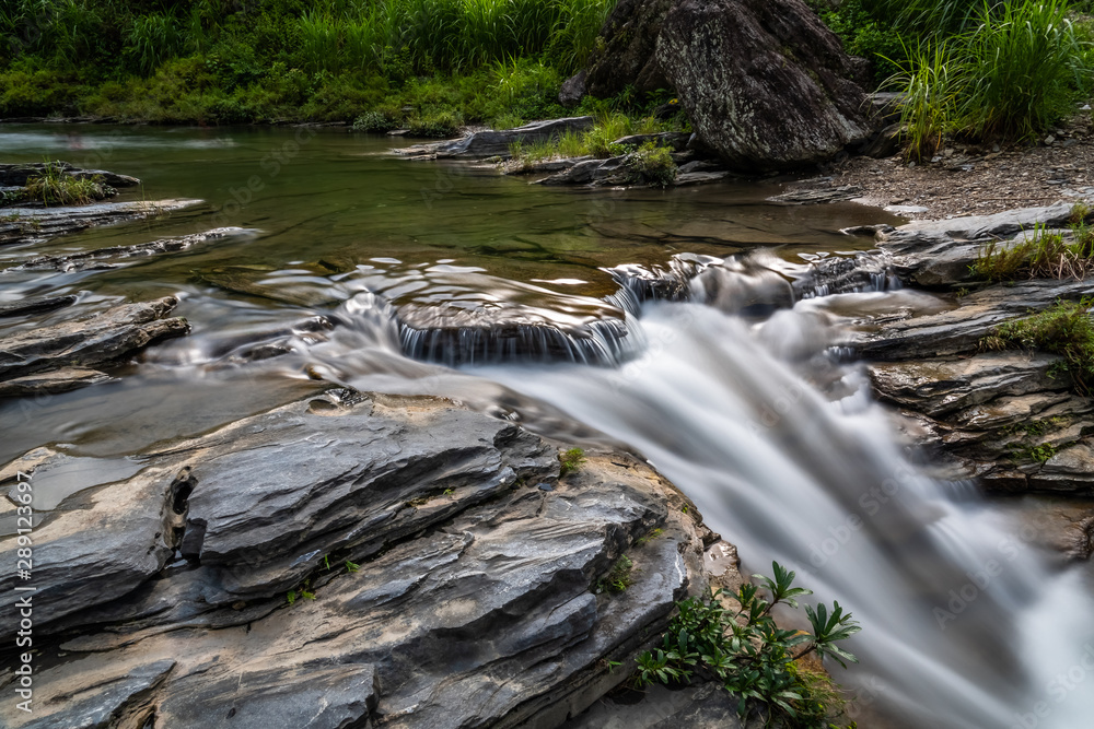 silky smooth waterfall. Long exposure shot of crystal clear fall at ...