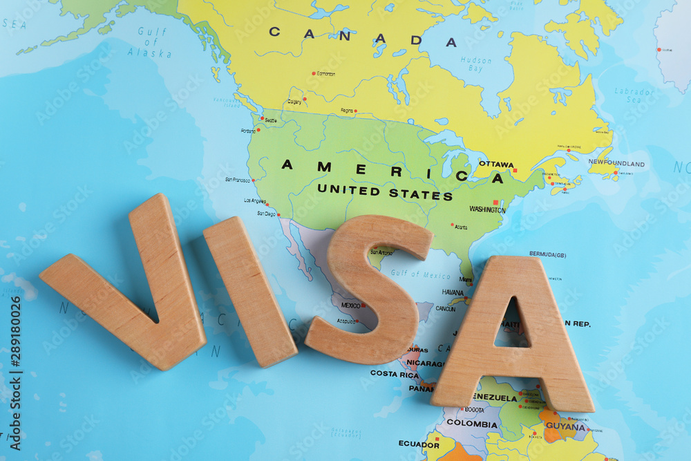 Word Visa made of wooden letters near USA on world map, top view Stock ...