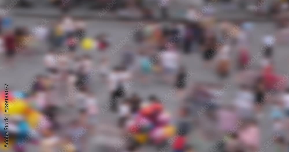 Defocus, blurry, abstract 4k time lapse of crowd of people walking ...
