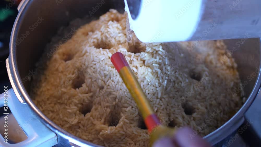 Preparation of the rice when cooking Plov traditional dish from ...
