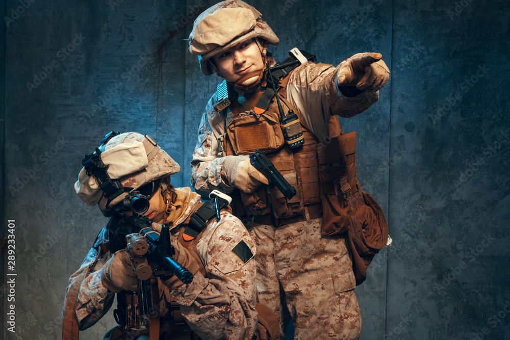 Two well equipped US army commandos armed with assault rifles. Studio ...