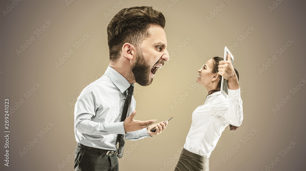 Angry businessman screaming at employee in the office. Caucasian woman ...