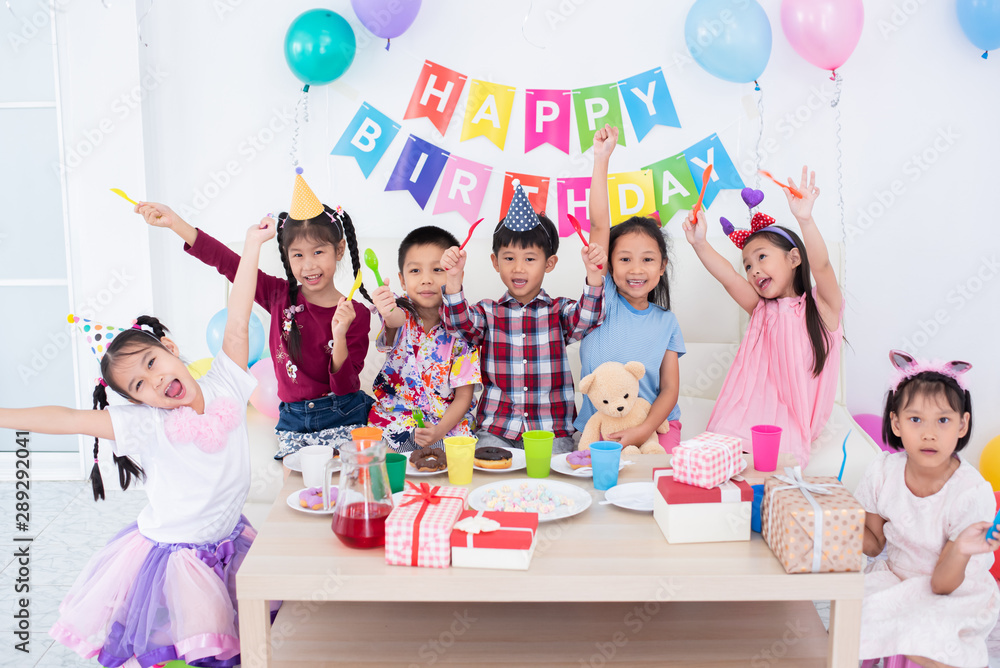 Adorable Asian schoolkids group enjoy the birthday party at home with ...