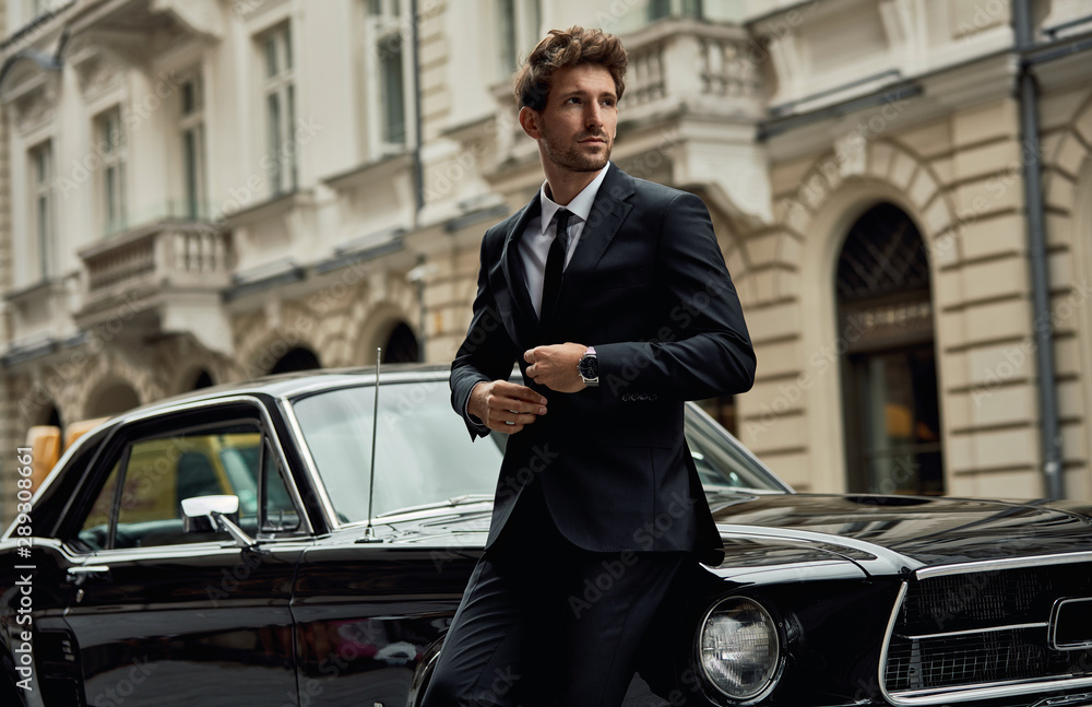 Young handsome man with black classic car wear black suit Stock Photo ...