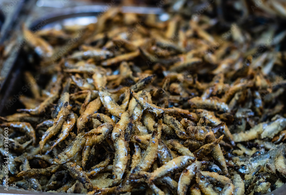 Fried little fish in market or food festival, food truck, food market ...