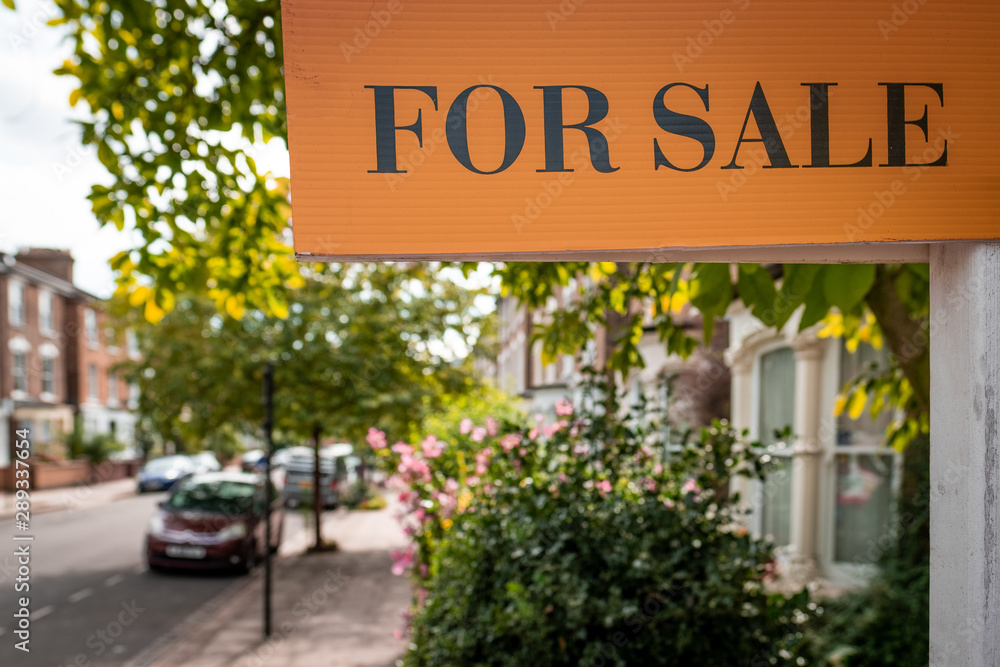 House 'For Sale' sign on suburban street of houses Stock Photo | Adobe ...