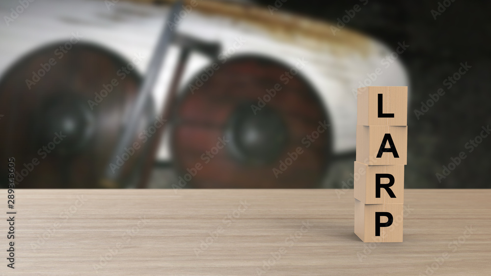 Larp word wooden cubes on table vertical over blur shield, boat, sword ...