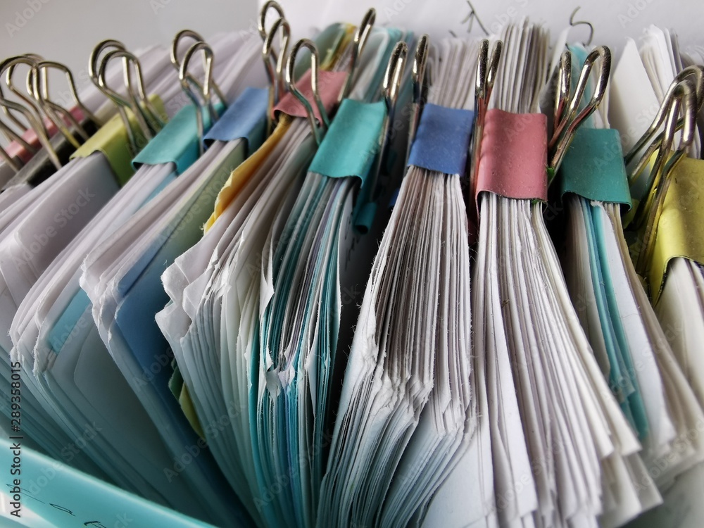 Foto de Small Square Sheets of Paper with a Curved Edges and Metal ...