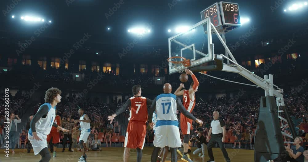 Basketball players on big professional arena during the game. Tense ...