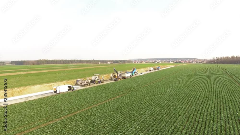 Building concrete pavements with modern road construction plants. Fully ...