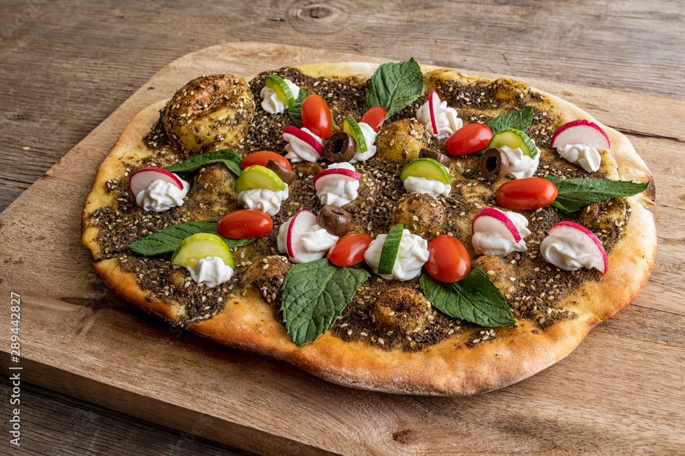 lebanese Manoushe ,bread of thyme topped with mint, reddish, and Labneh ...