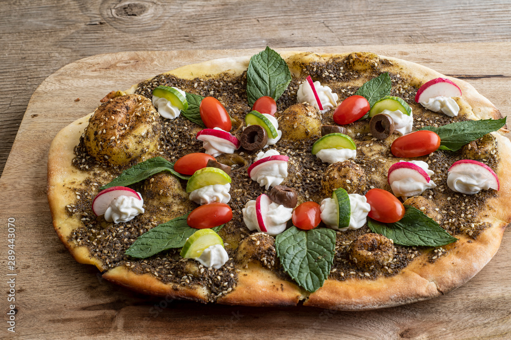 lebanese Manoushe ,bread of thyme topped with mint, reddish, and Labneh ...