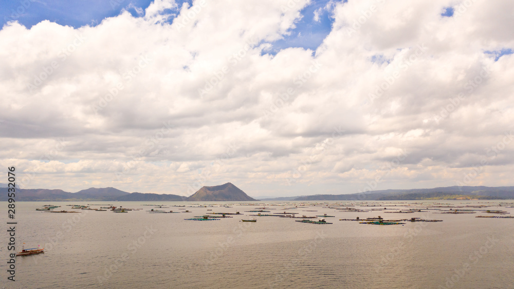 Lake Taal with a volcano and fish cages on a fish farm, top view. Luzon ...