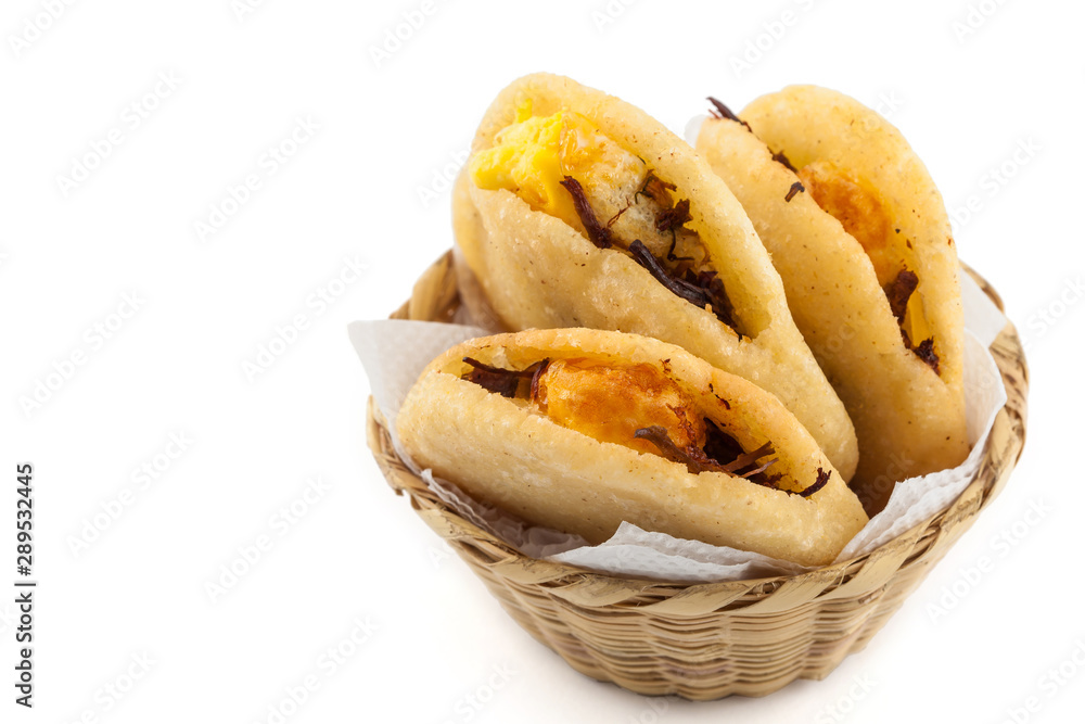 Arepa de huevo. Traditional Colombian fried arepa filled with egg and ...