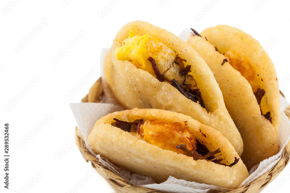 Arepa de huevo. Traditional Colombian fried arepa filled with egg and ...