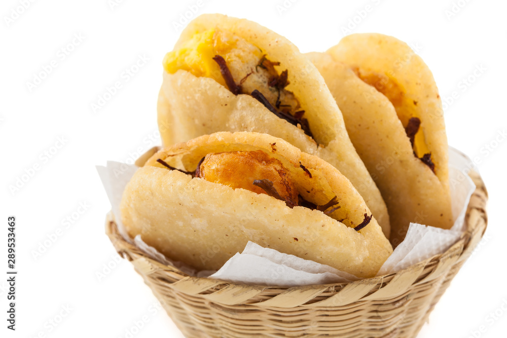 Arepa de huevo. Traditional Colombian fried arepa filled with egg and ...