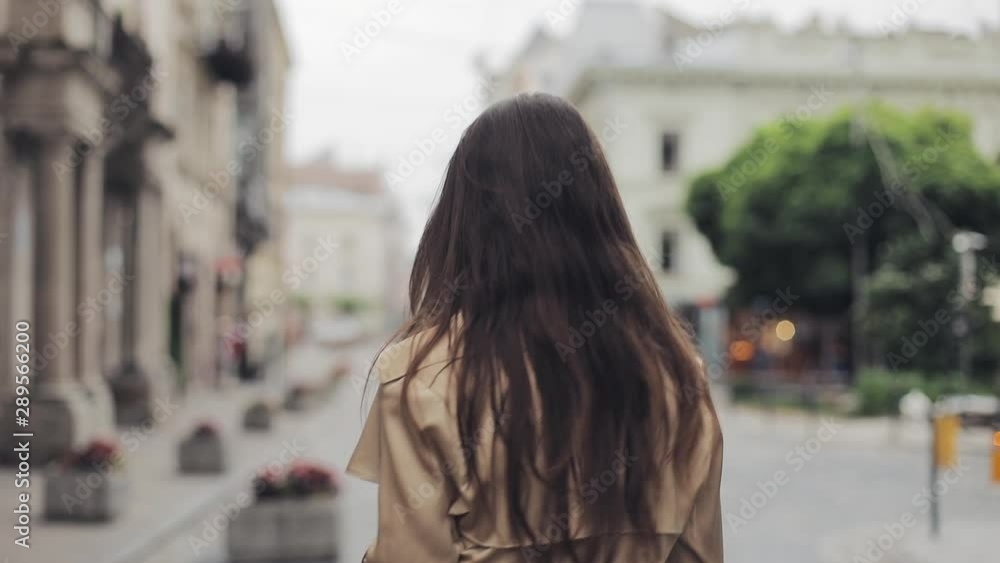 Backside Tracking Footage of Preety Young Girl Walking the Street ...