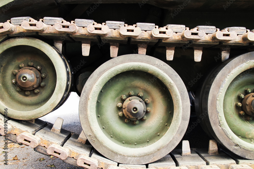 caterpillar of a military tank, close up side view of metal tracks and ...