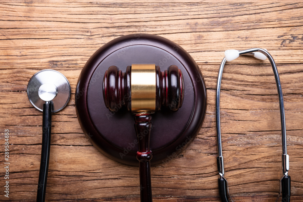 Gavel With Stethoscope Arranged On Table Stock Photo | Adobe Stock