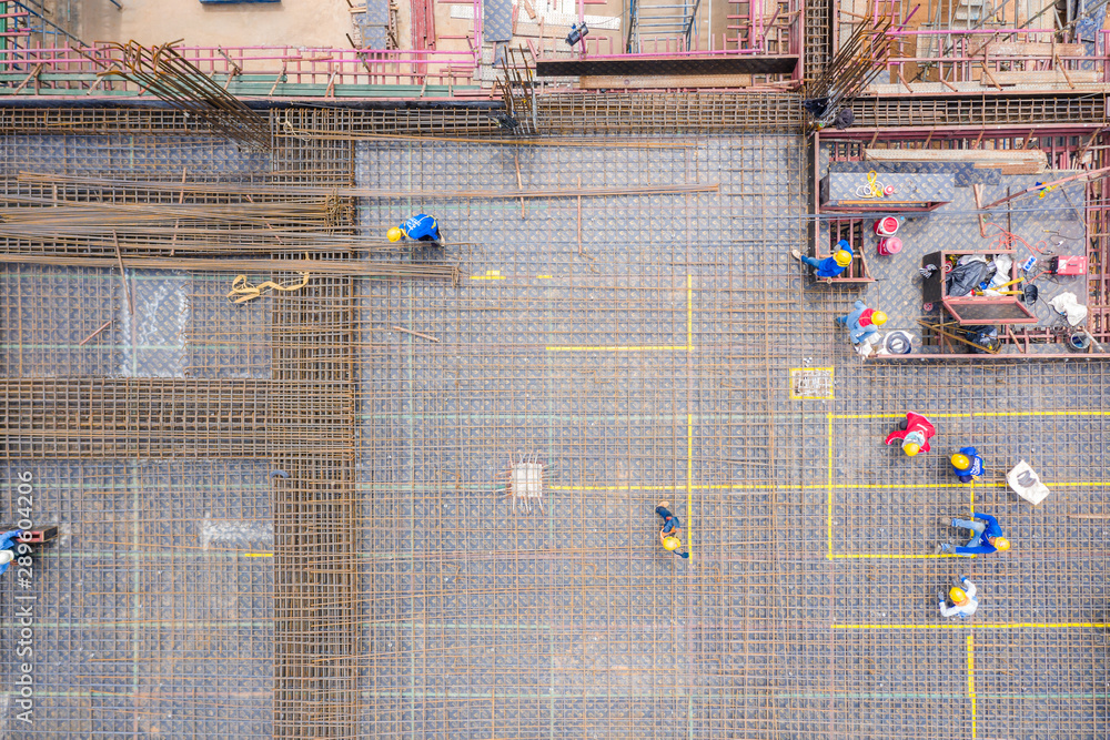 Aerial view of group of construction worker building in construction ...