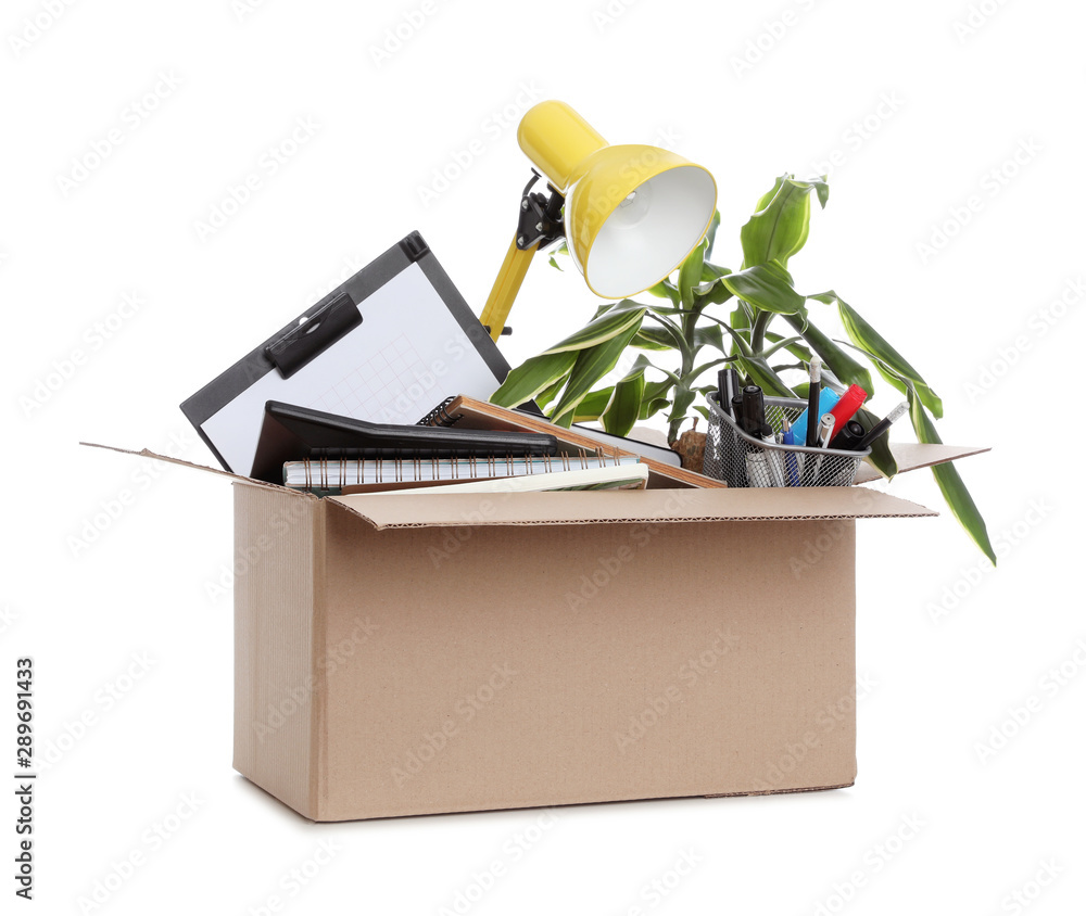 Cardboard box full of office stuff on white background Stock Photo ...