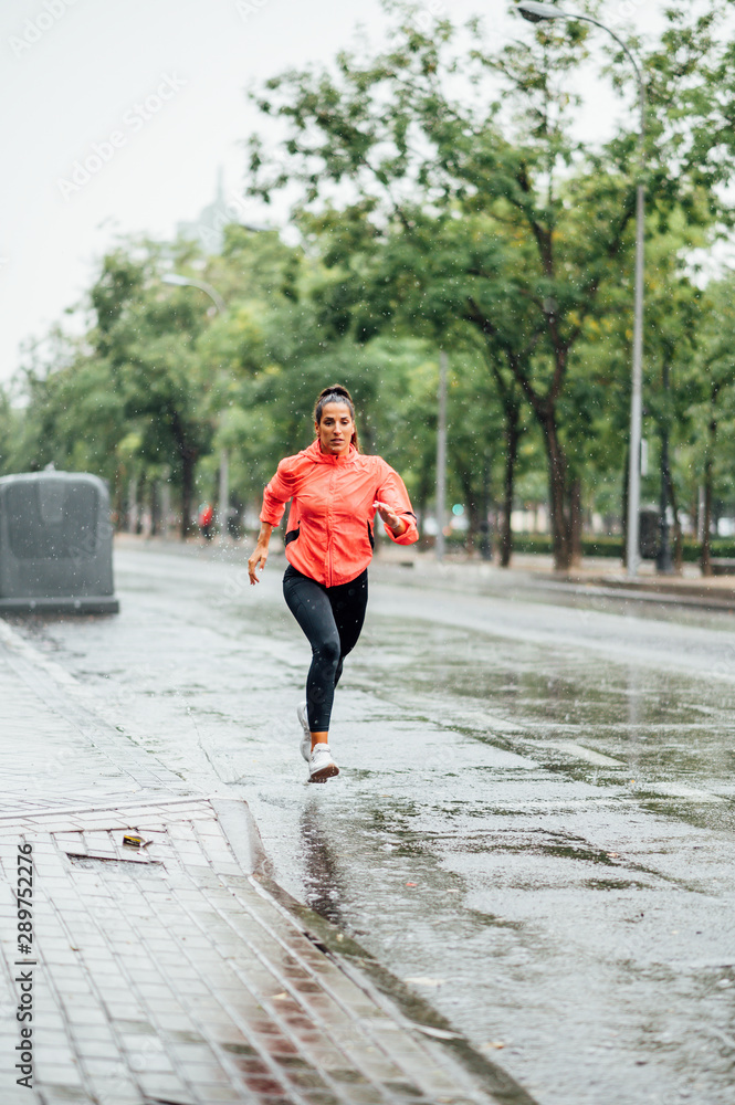 Woman Running In Rain