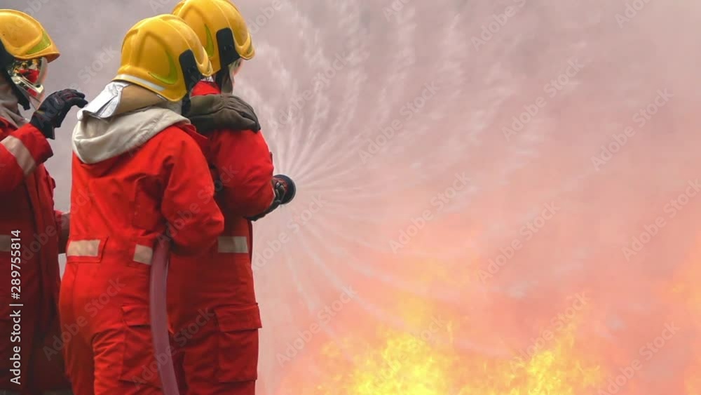 Slow motion wide shot firefighter in safety fire suit rescue ...