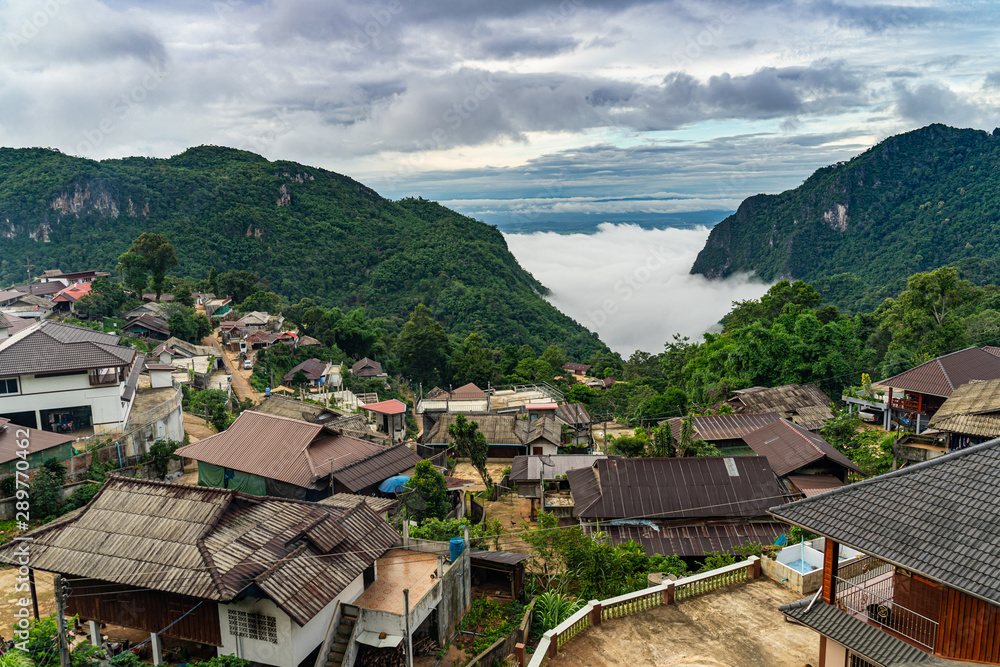 Misty mountain in the morning rainy season over small village at Doi ...