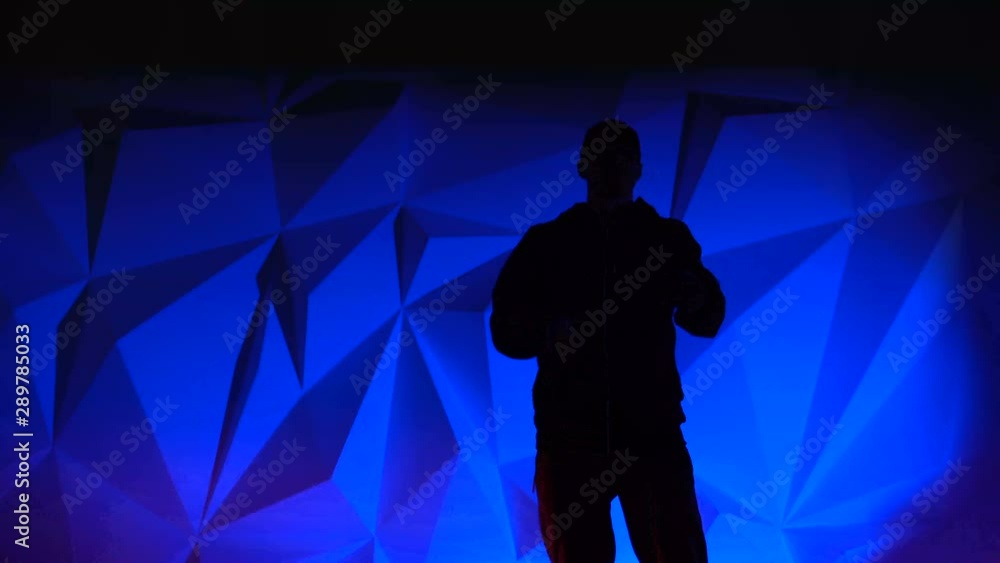 Rapper guy rap in front of the camera on a colorful background Stock ...