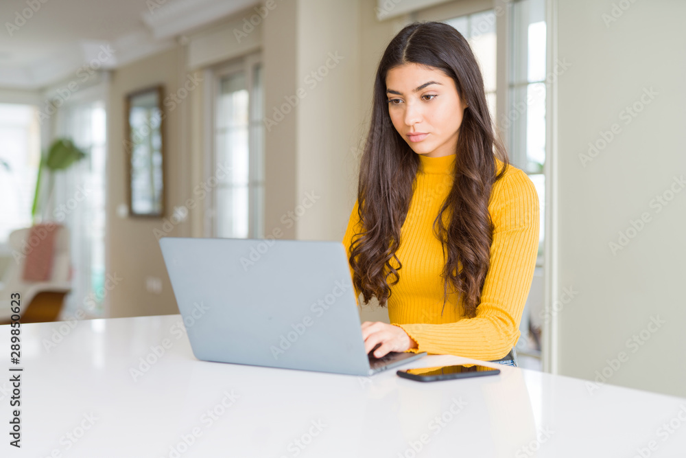 Beauitul young woman working using computer laptop concentrated Stock ...