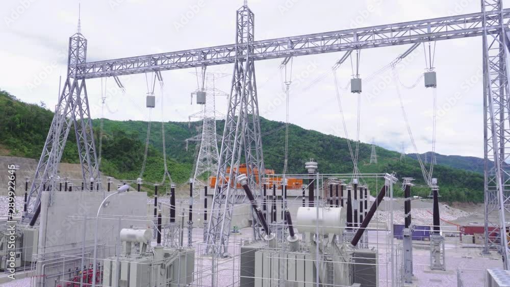 High voltage transformer at the hydroelectric dam.Large power ...