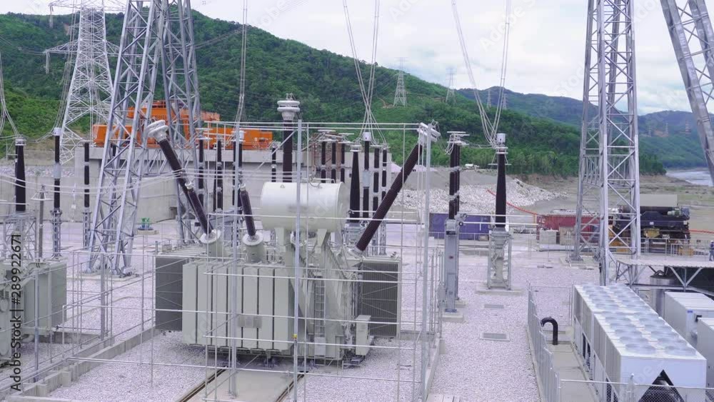 High voltage transformer at the hydroelectric dam.Large power ...