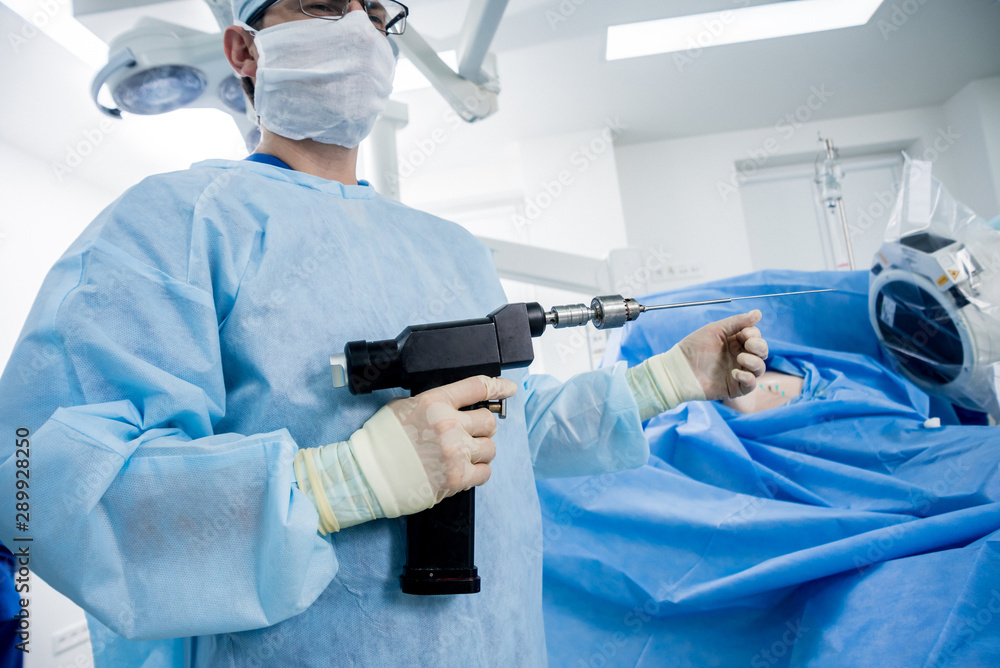 Arthroscope surgery. Orthopedic surgeons in teamwork in the operating ...