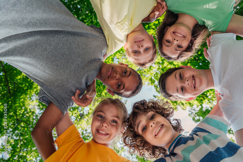 bottom view of happy multicultural children looking at camera Stock ...