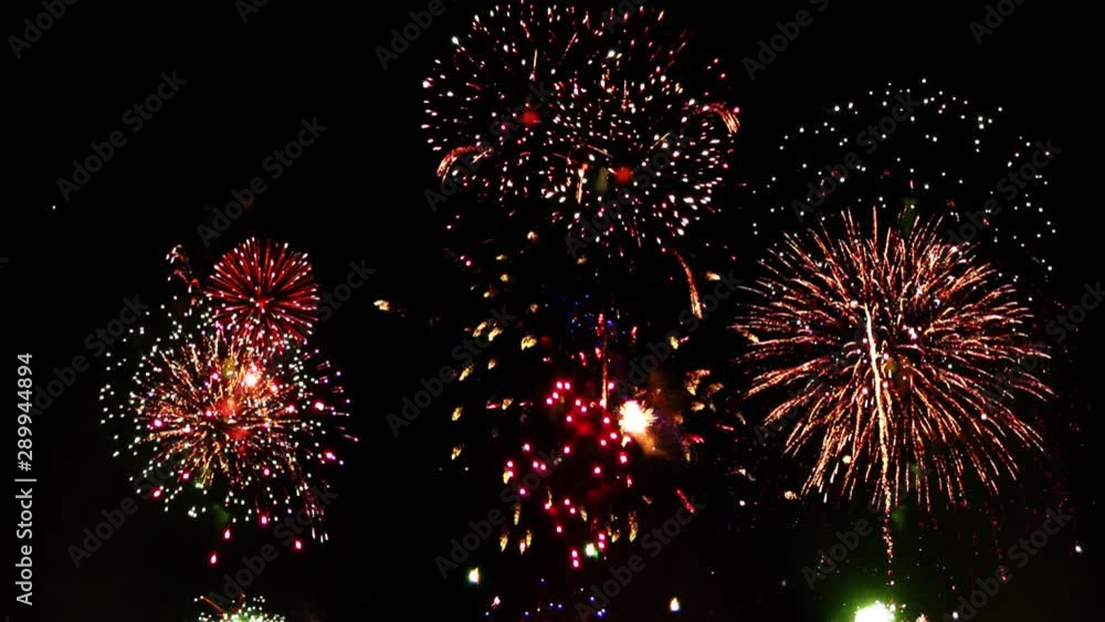 4K. loop seamless of real fireworks background. abstract blur of real ...