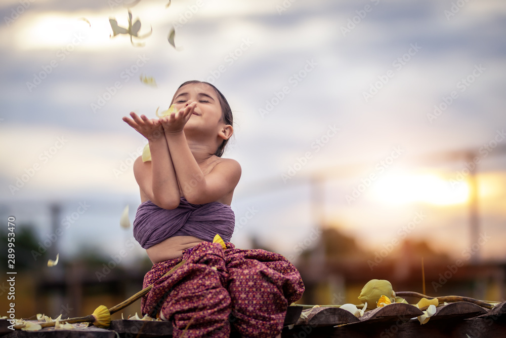 foreigner girl in Thai costume learning,playing with happy on holiday ...