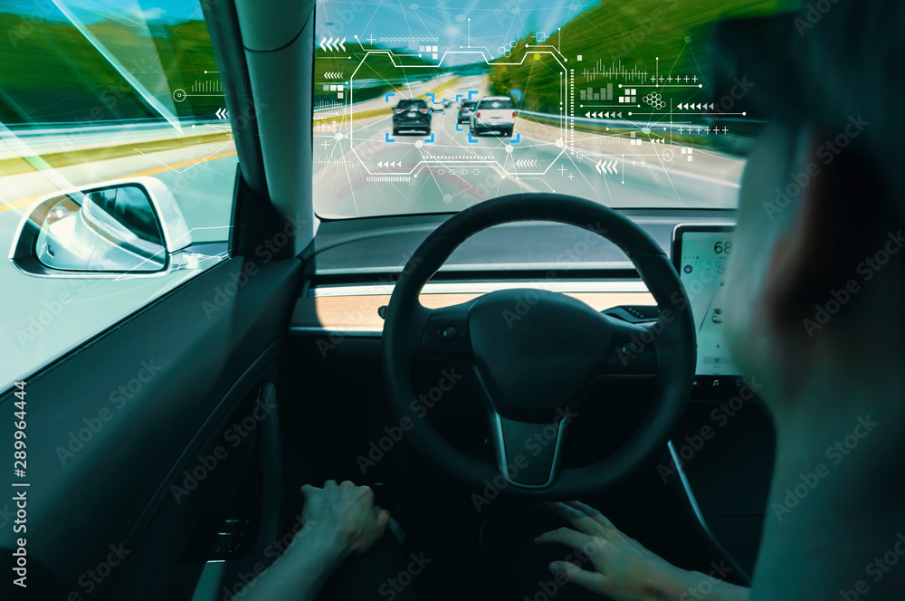 Person in a self driving autonomous car with autopilot Stock Photo ...