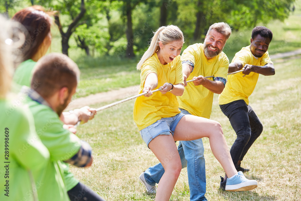 Team in tug of war as teambuilding exercise Stock Photo | Adobe Stock