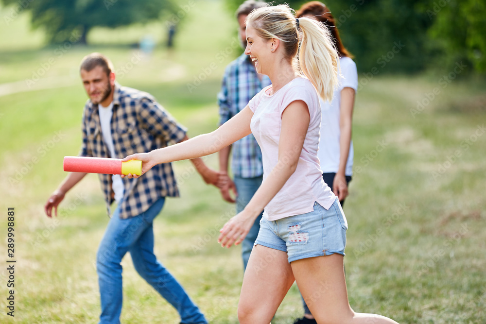 Young woman hands the baton Stock Photo | Adobe Stock