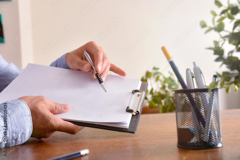 Man showing blank sheet of paper side view Stock Photo | Adobe Stock