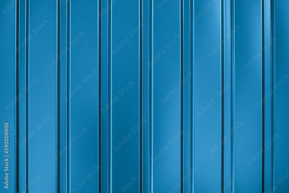 Blue metallic striped surface. Metal wall siding. Striated fence with ...