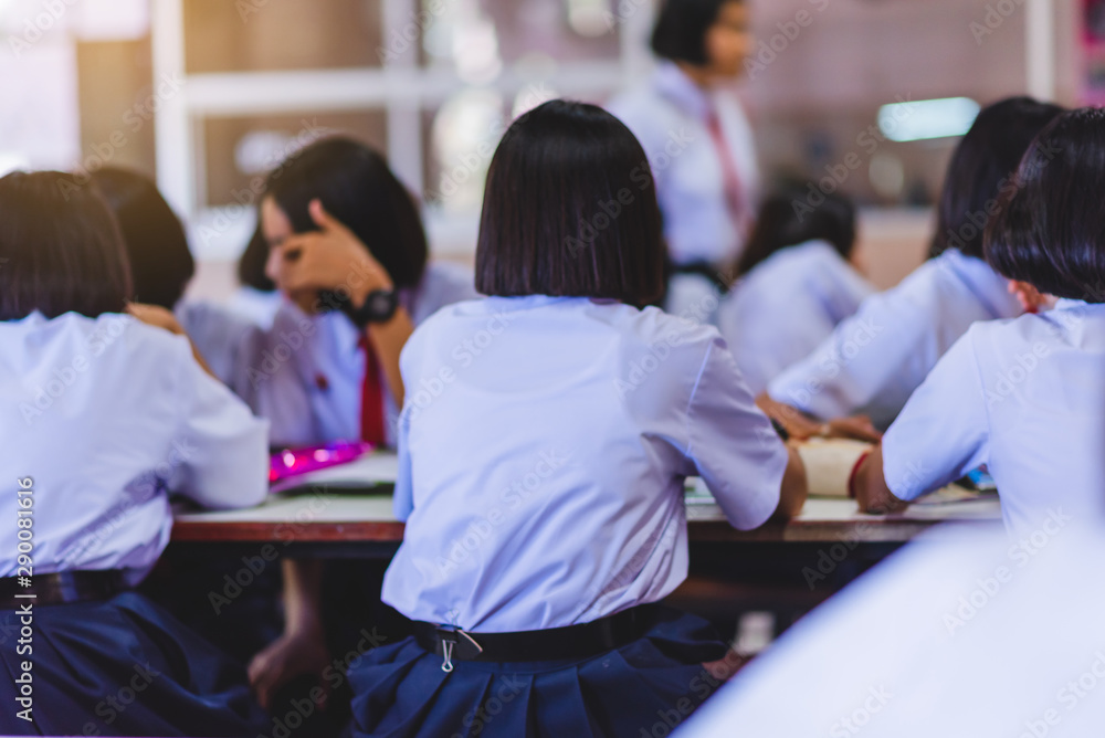 The Asian high school students in white uniform are studying in the ...