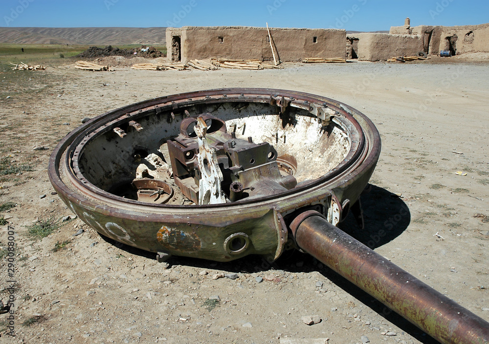 Bamyan (Bamiyan), Central Afghanistan. A turret from a destroyed tank ...