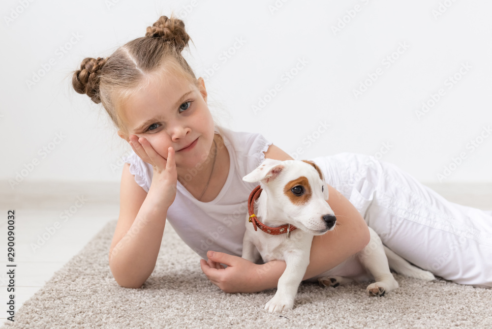 Childhood, pets and dogs concept - Tited little child girl posing on ...
