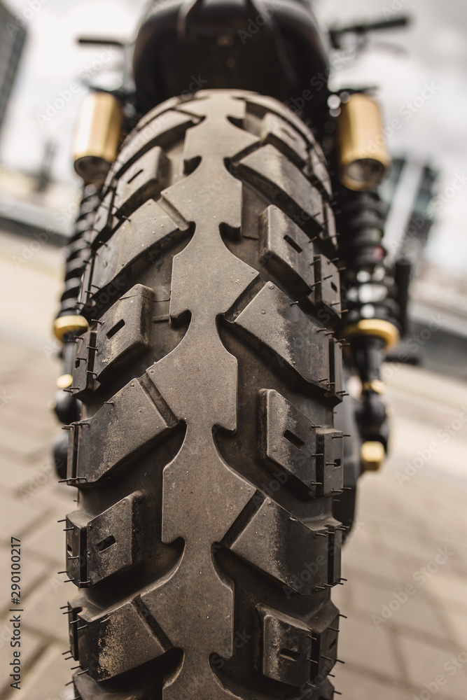 Rear view of motorcycle wheel with tire tread closeup Stock Photo ...