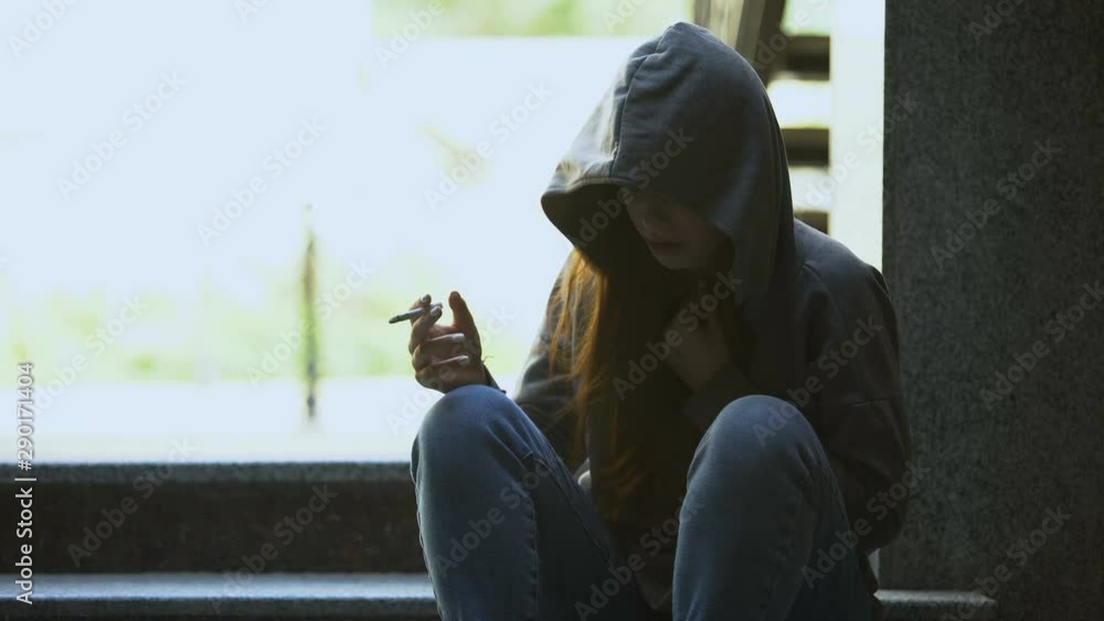 Lonely sad teen girl smoking cigarette and coughing, bad habits and ...