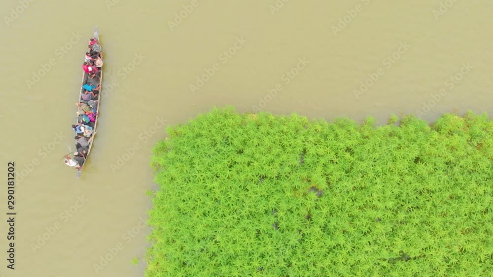 4k Aerial Top Down shot of People in a Row Boat getting evacuated to ...